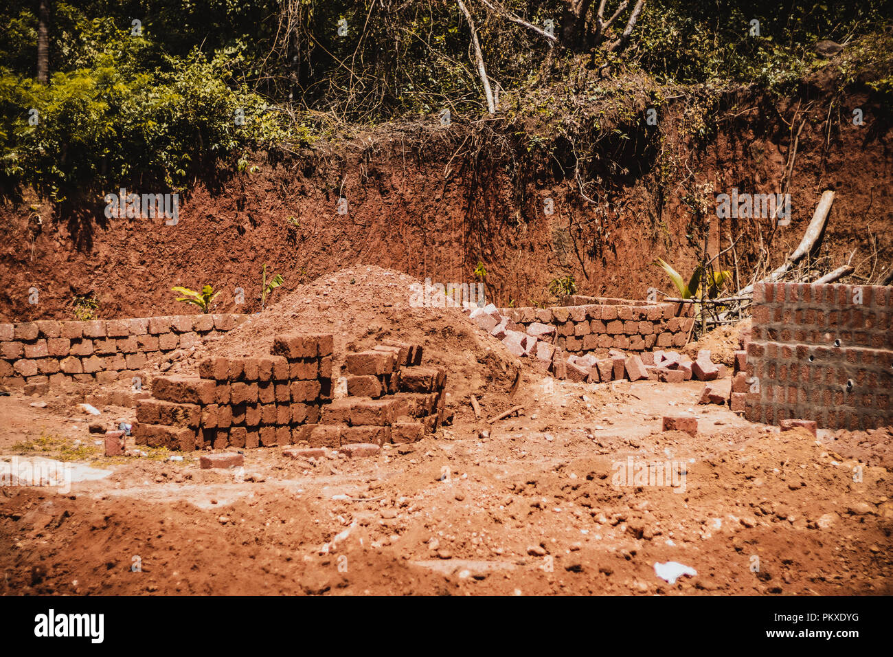 Bricks and soil on a house construction site Stock Photo - Alamy