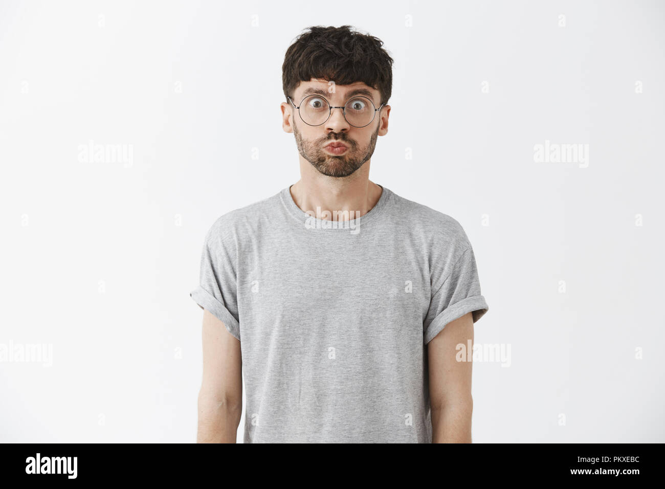 Waist-up shot of playful good-looking and stylish caucasian male model ...