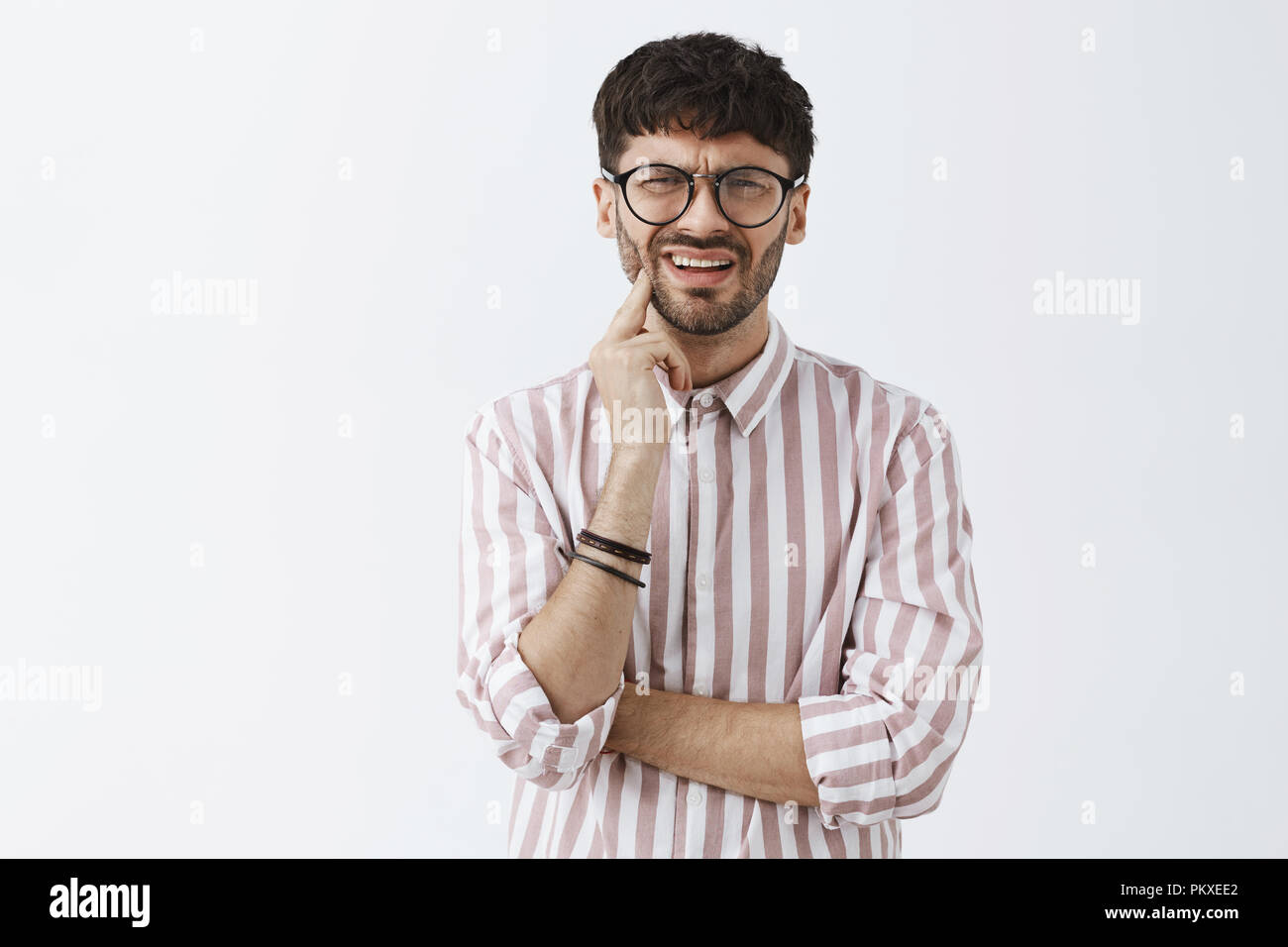 Finger on cheek hi-res stock photography and images - Alamy