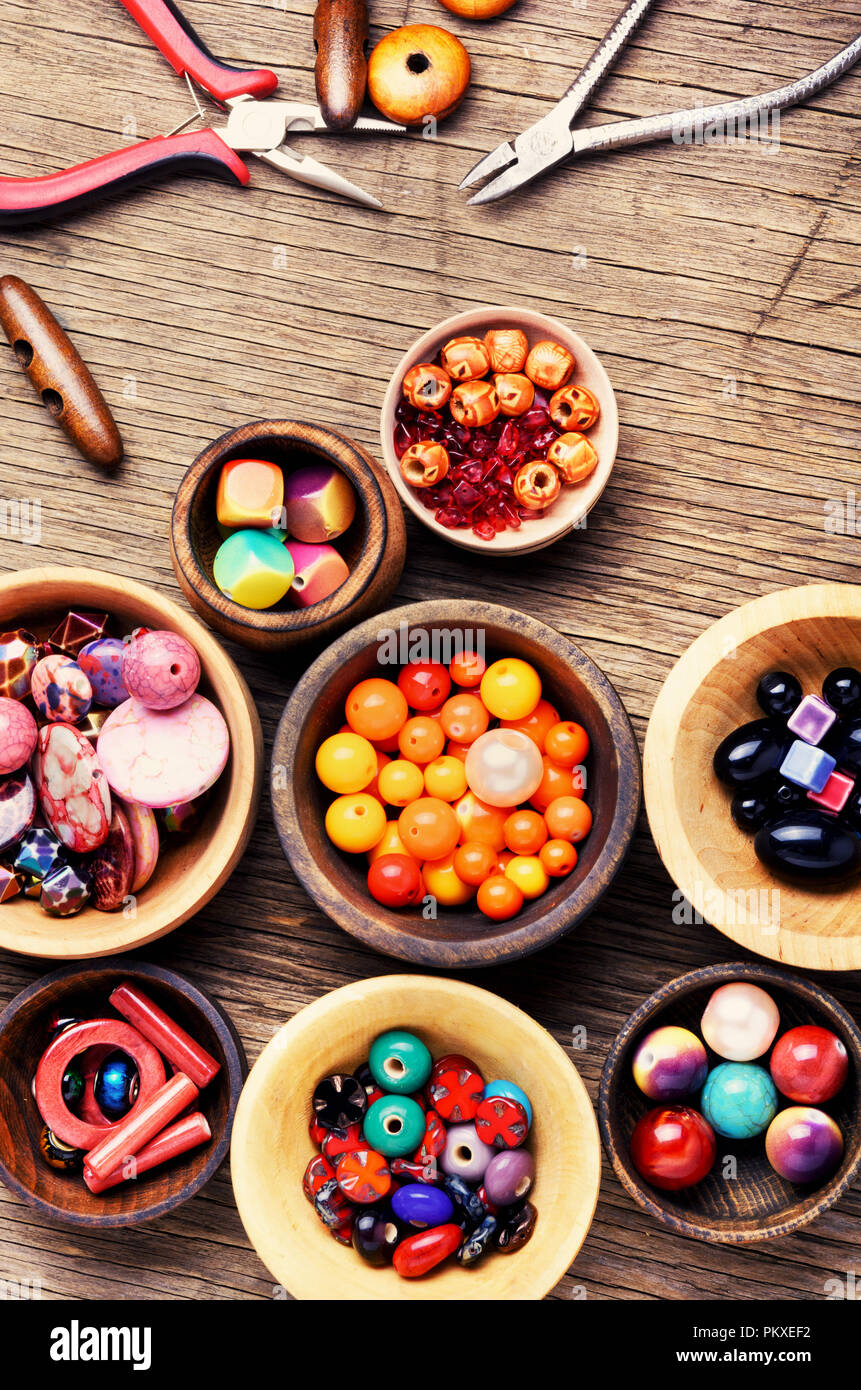 Variety of shapes and colors beads to make a bead necklace.Handcraft ...