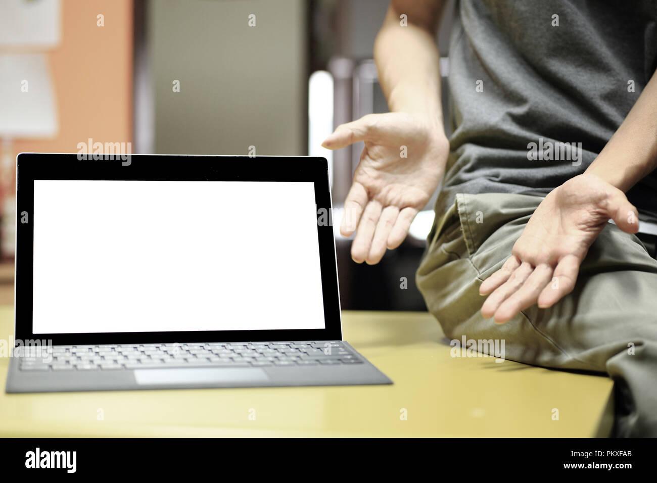 Hand typing on Laptop computer Keyboard displaying white background. PC ...