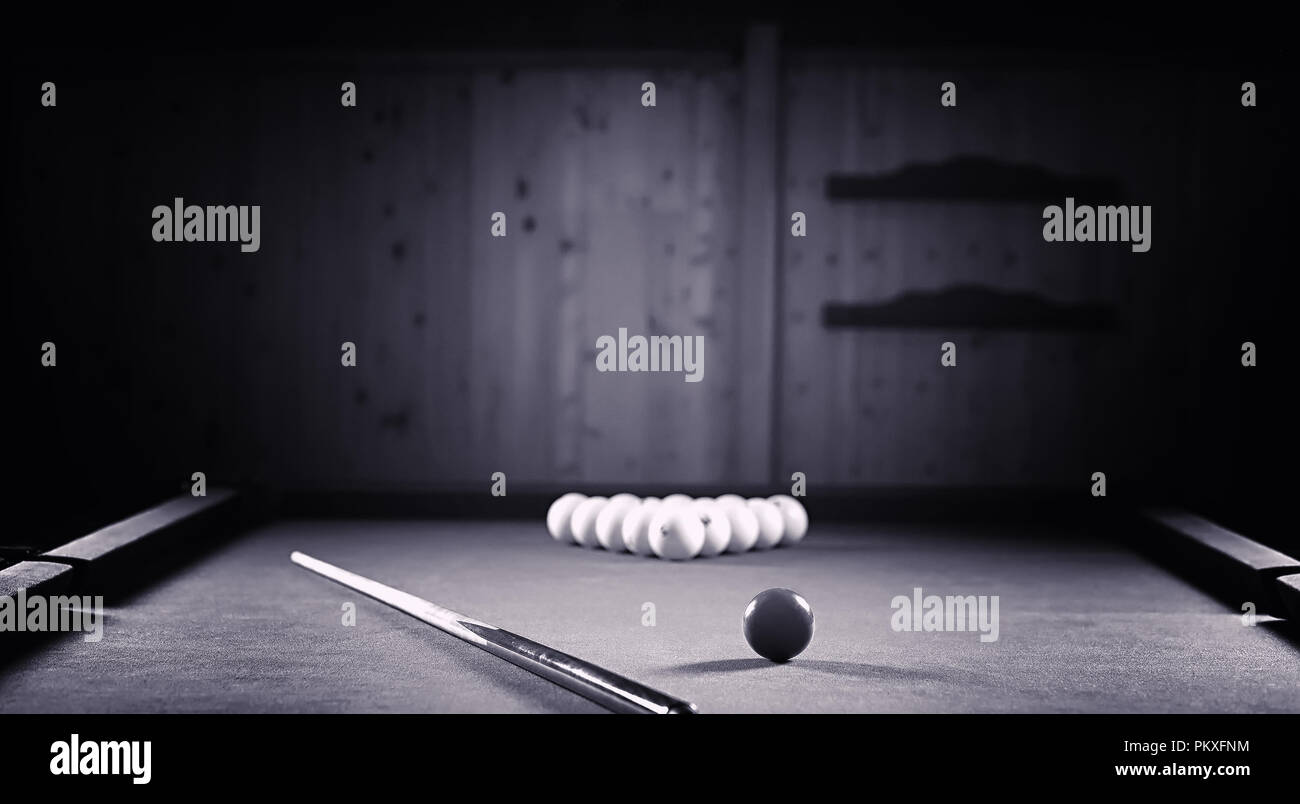 A man with a beard plays a big billiard. Party in a 12-foot pool Stock ...