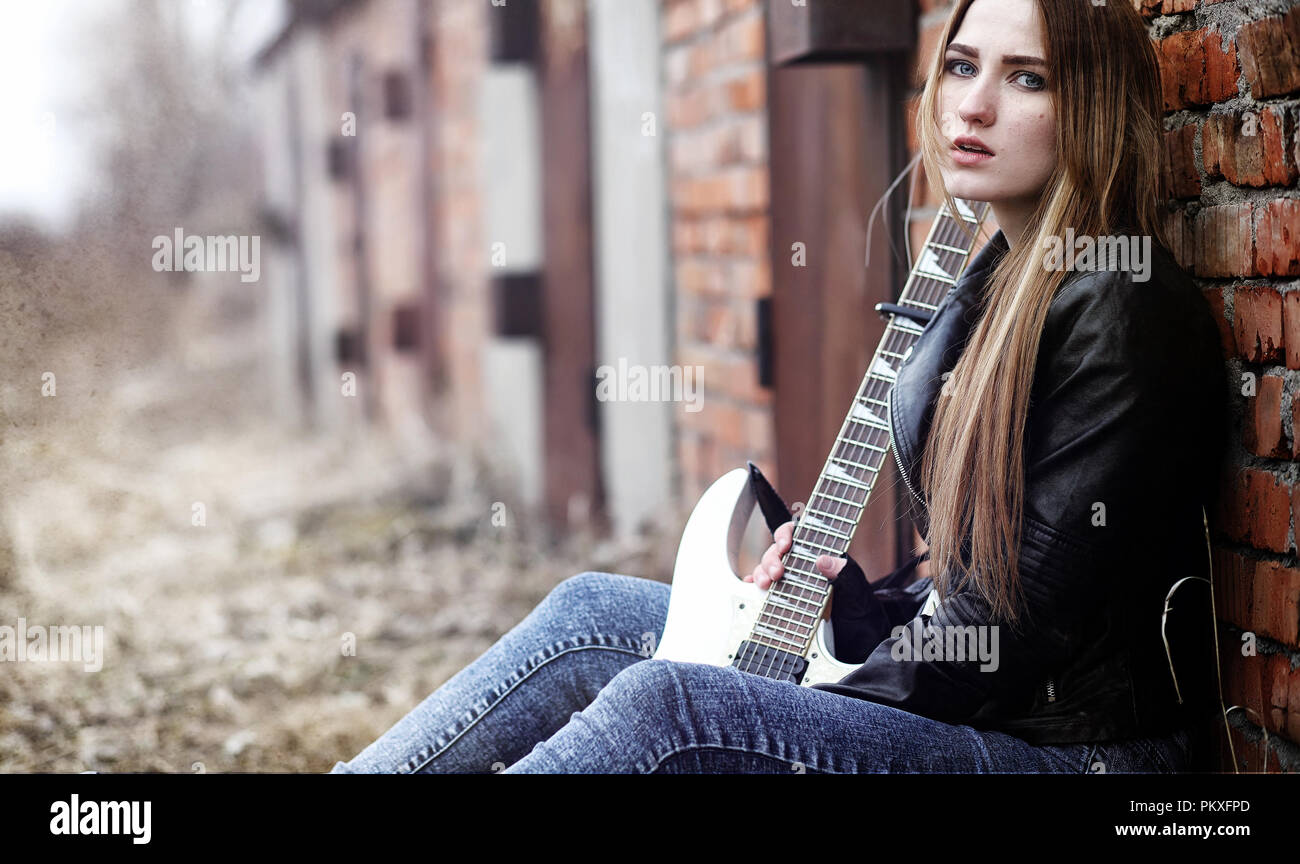 Beautiful young girl rocker with electric guitar. A rock musicia Stock ...