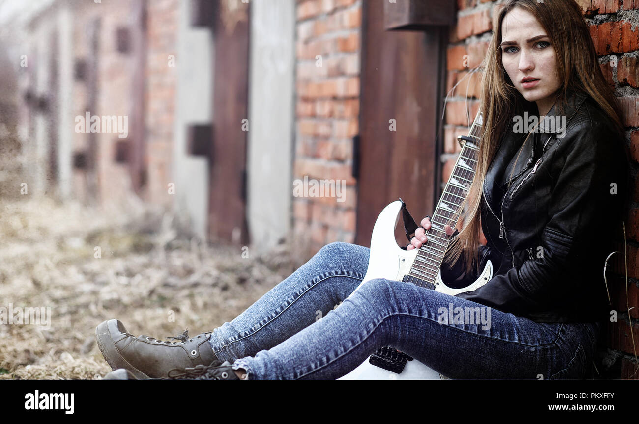 Beautiful young girl rocker with electric guitar. A rock musicia Stock ...