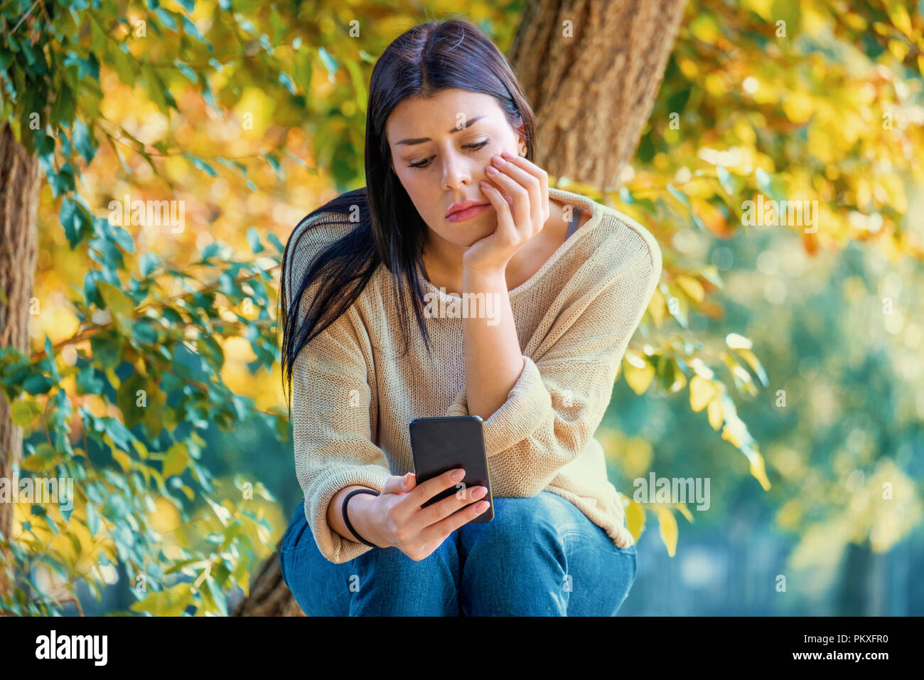 Young woman waiting a message from her boyfriend Stock Photo - Alamy