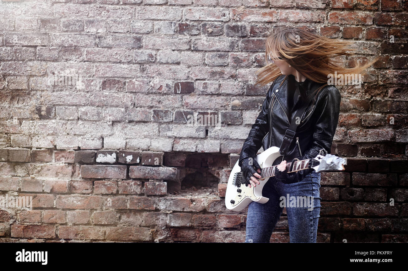 Beautiful young girl rocker with electric guitar. A rock musicia Stock ...