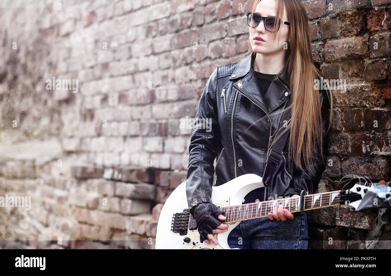 Beautiful young girl rocker with electric guitar. A rock musicia Stock ...