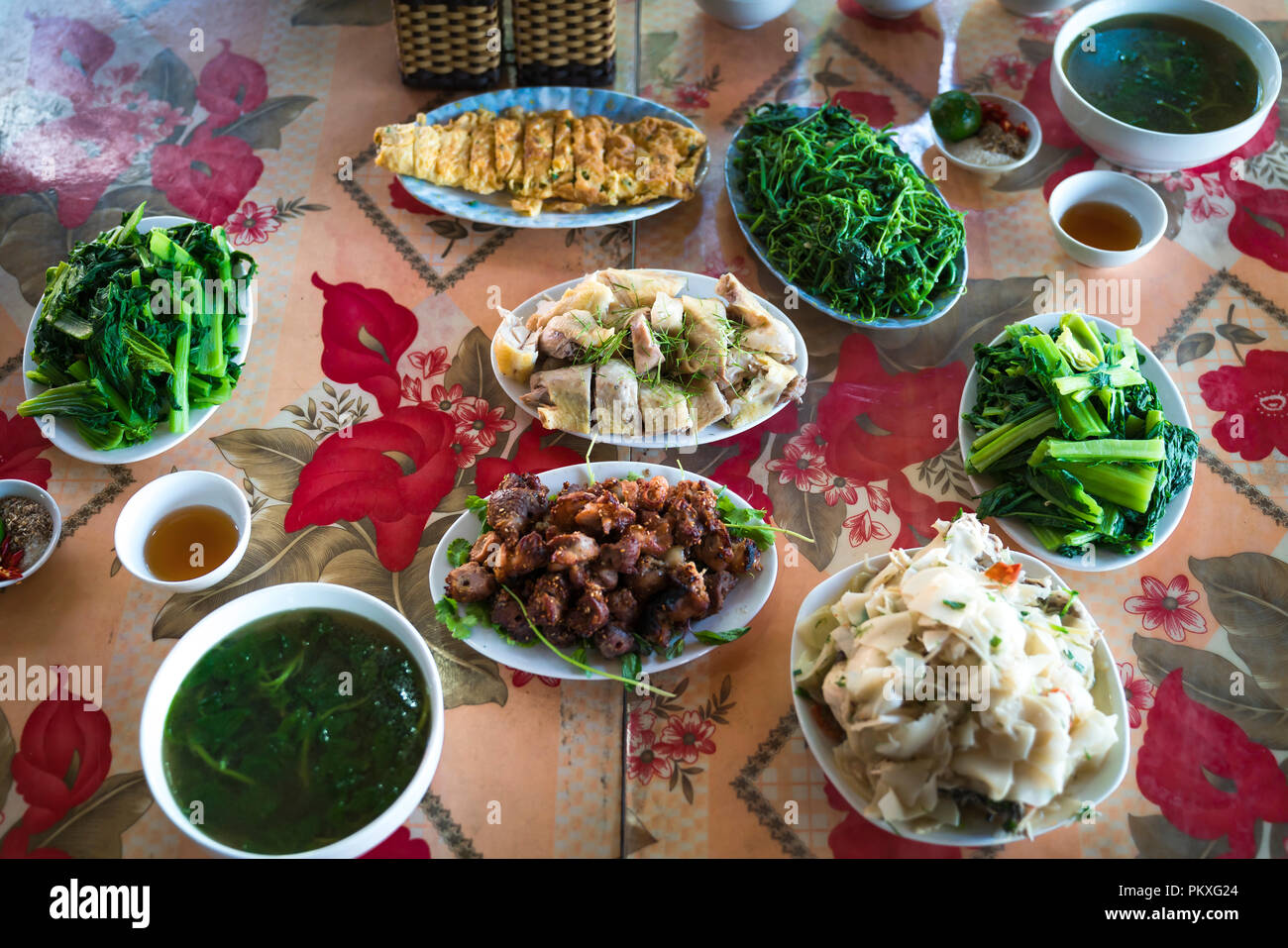 Vietnamese family lunch set: Rice, salad, boiled chicken, fried pork ...