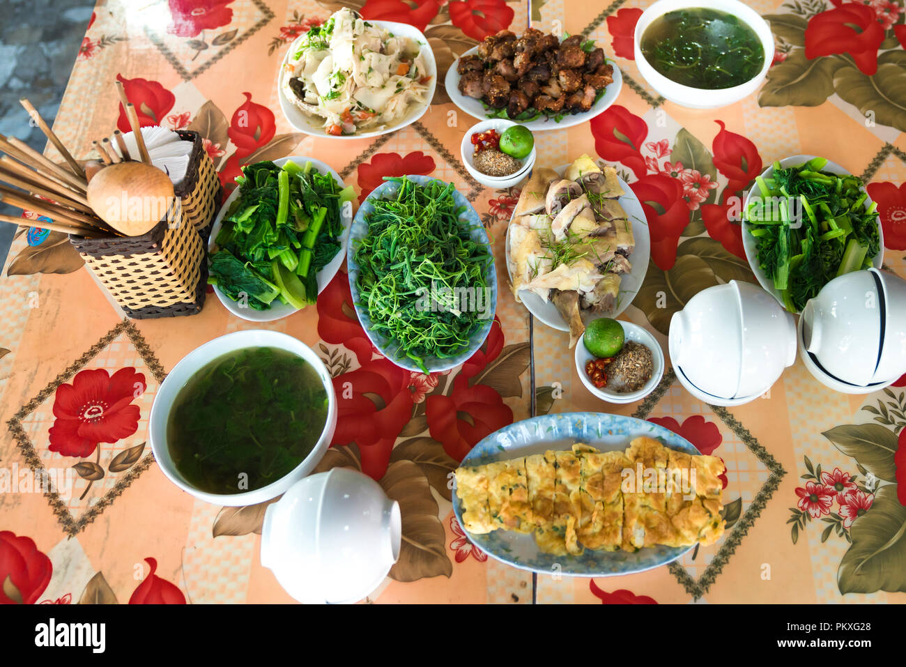 Vietnamese family lunch set: Rice, salad, boiled chicken, fried pork ...