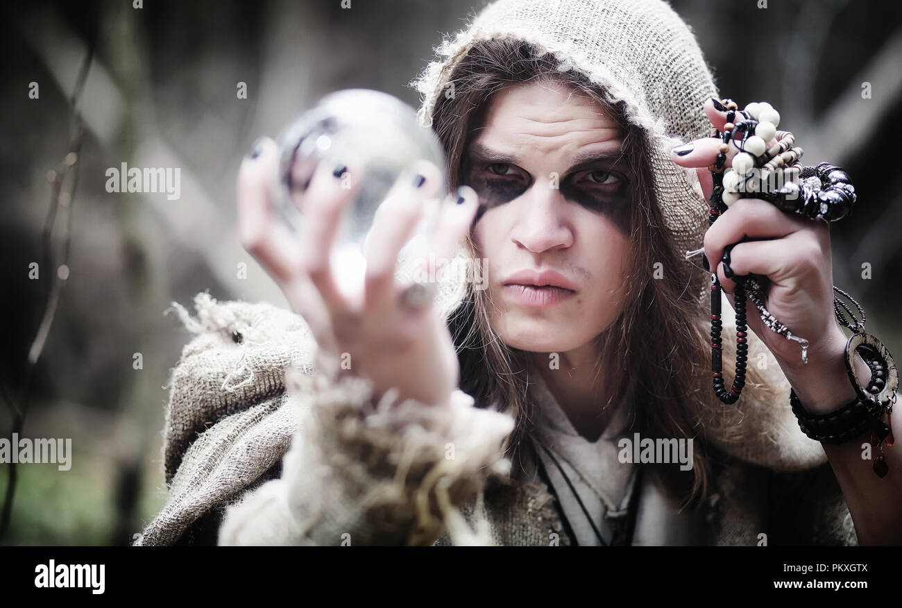 Fairy magician. A sorcerer with a glass sphere, a magical spell Stock ...