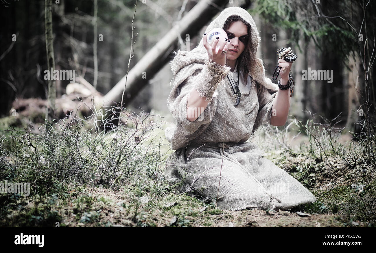 Fairy magician. A sorcerer with a glass sphere, a magical spell Stock ...