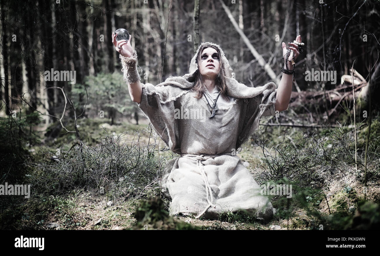 Fairy magician. A sorcerer with a glass sphere, a magical spell Stock ...