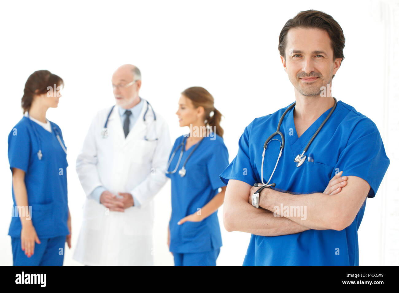 Group of doctors isolated on white background, studio shot Stock Photo ...