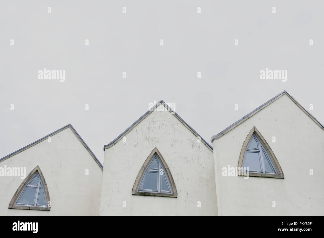 Church roof and windows triangle shape in three and blank empty sky ...