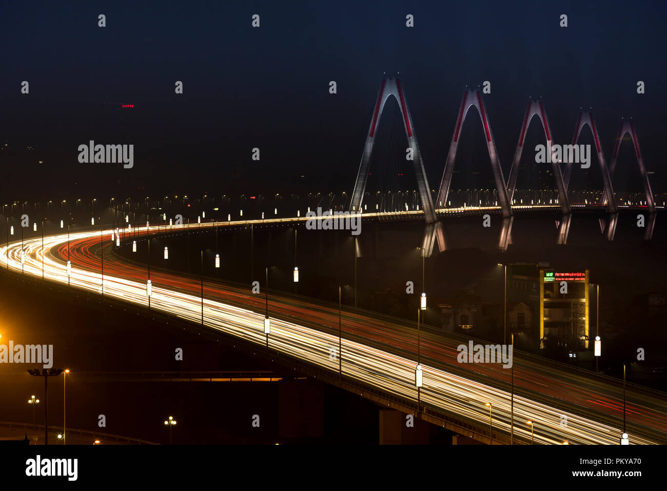 The Nhat Tan Bridge in night Stock Photo - Alamy