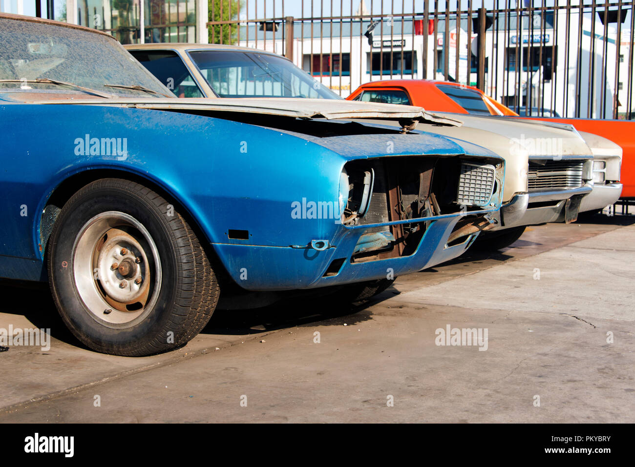 A view of classic vintage damaged American car in a garage Stock Photo ...