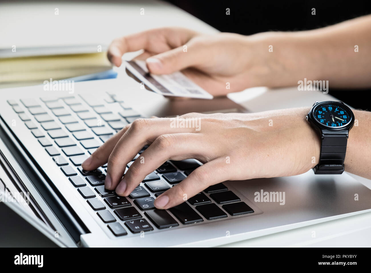 Using credit card for online payment. Person filling bank account ...