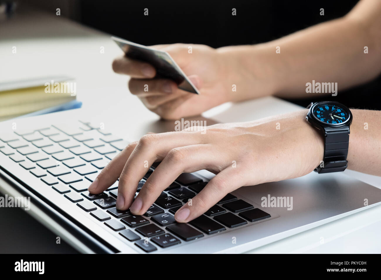 Using credit card information for online payment. Person filling bank ...