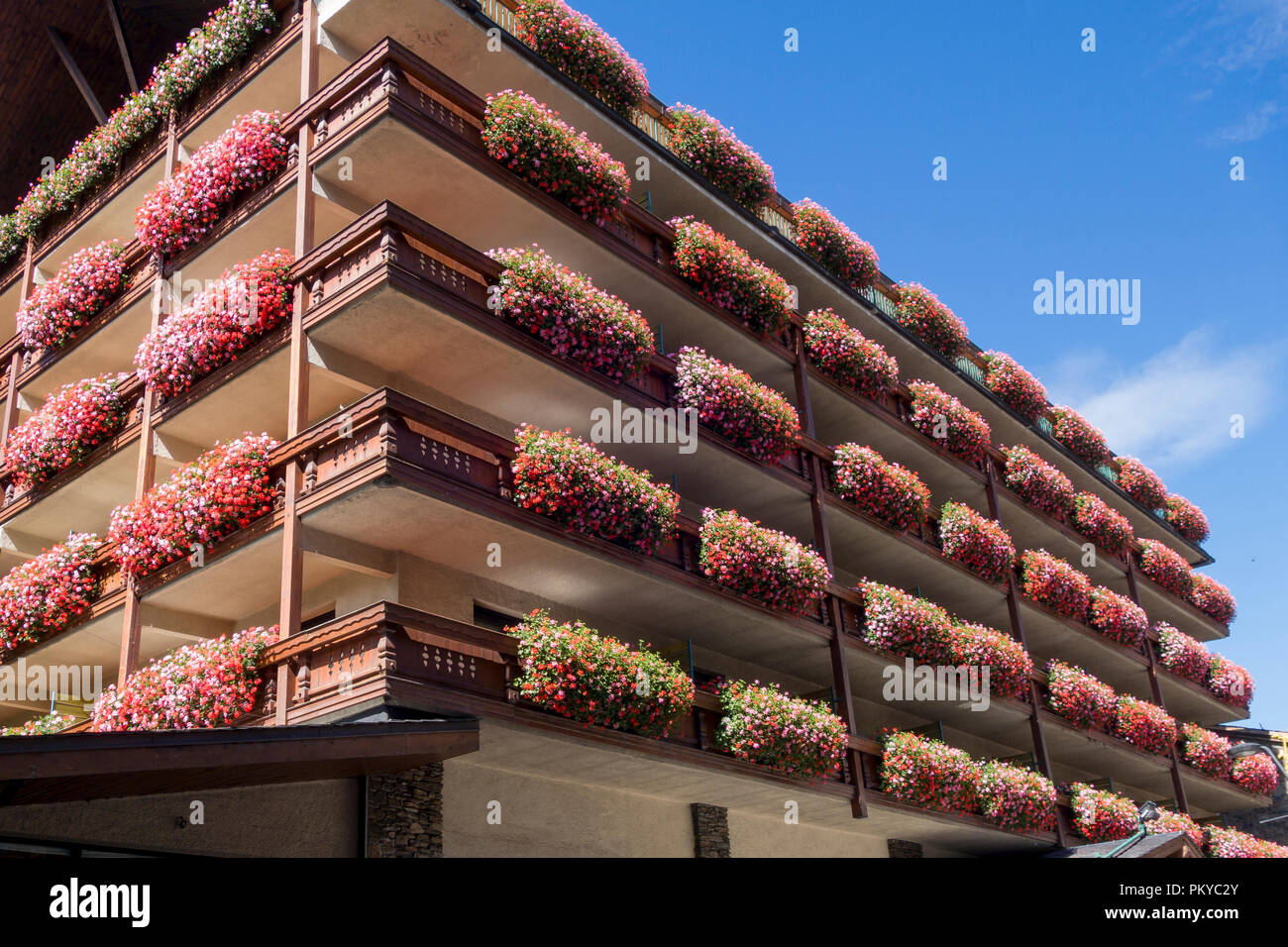 Beautiful building with flowers in the balconies Stock Photo - Alamy