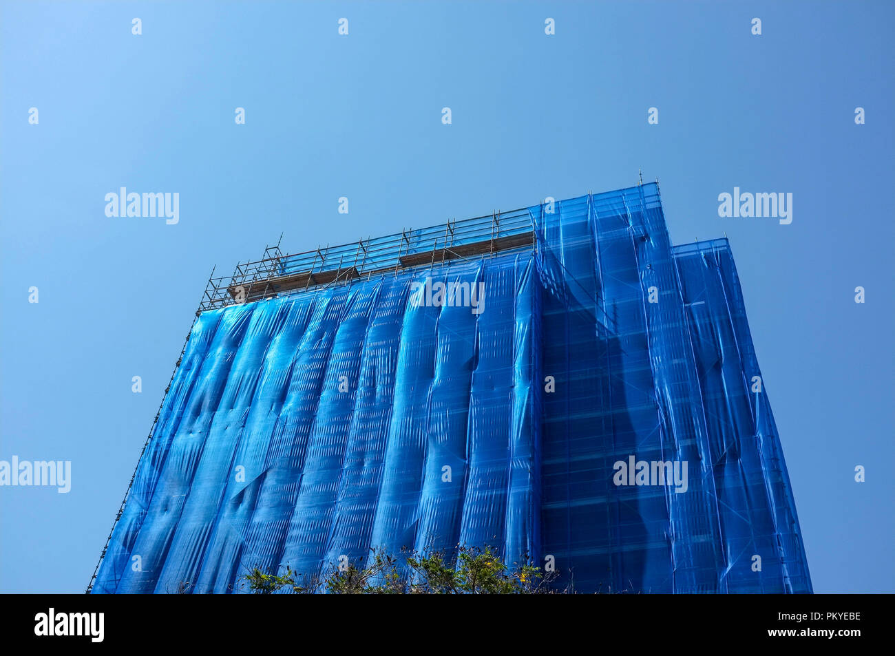 blue scaffolding over a building Stock Photo - Alamy