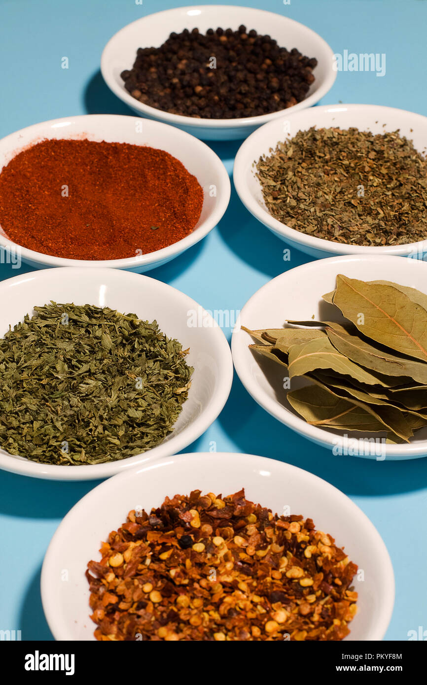 Small white dishes with assortment of cooking spices Stock Photo - Alamy