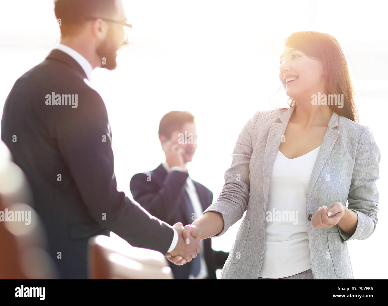 handshake between colleagues in the workplace Stock Photo - Alamy