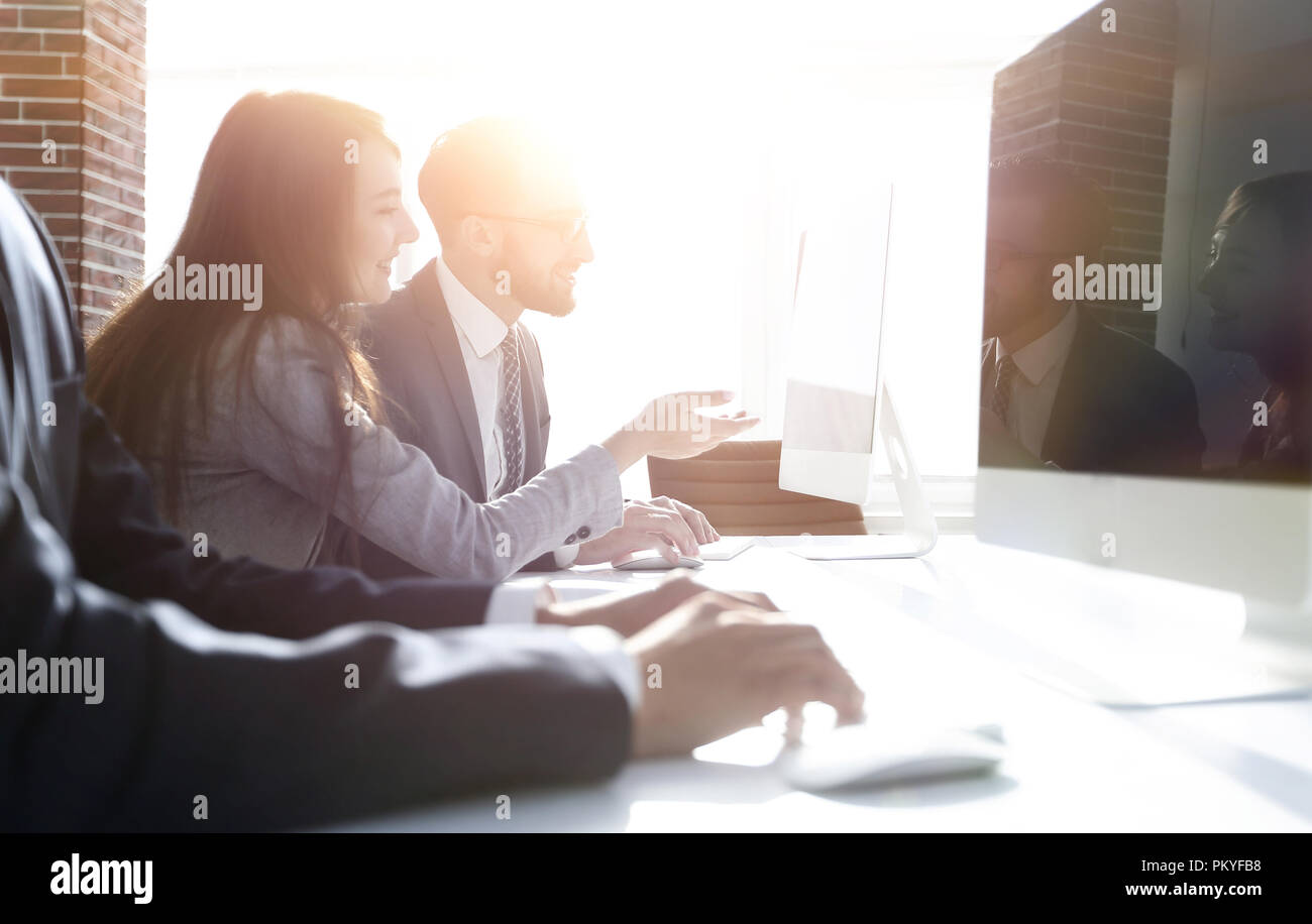 office employees sitting at their work Desk Stock Photo - Alamy