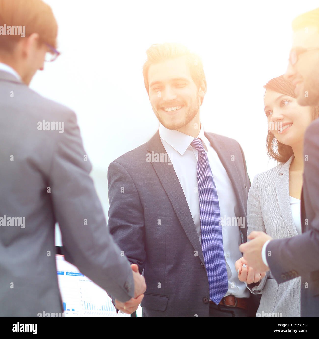Confident young people, handshake and smile Stock Photo - Alamy
