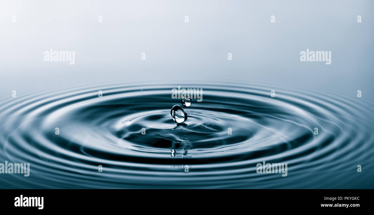 Water drop falling into water making a perfect droplet splash Stock Photo - Alamy