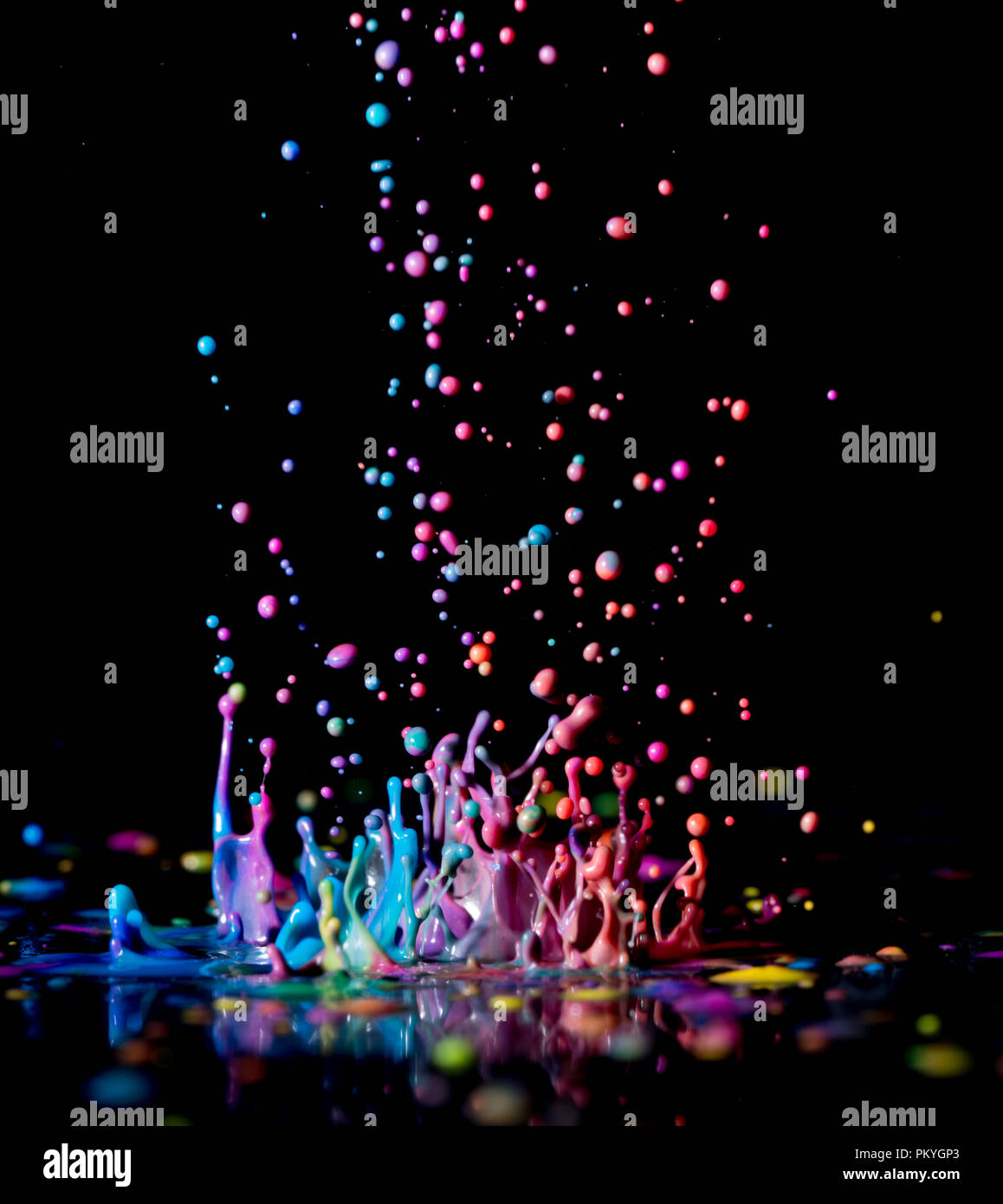 Abstract sculptures of colorful splashes of paint. Dancing liquid on a ...