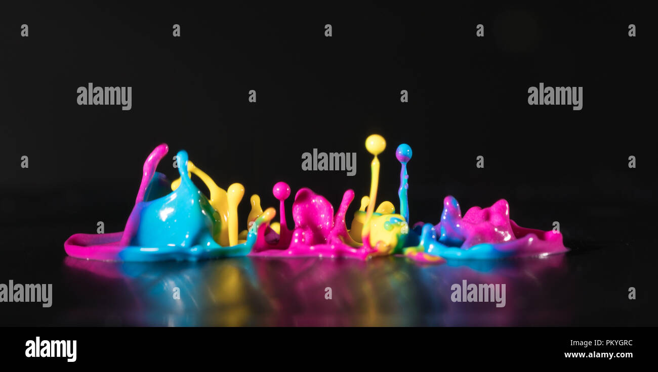 Abstract sculptures of colorful splashes of paint. Dancing liquid on a ...