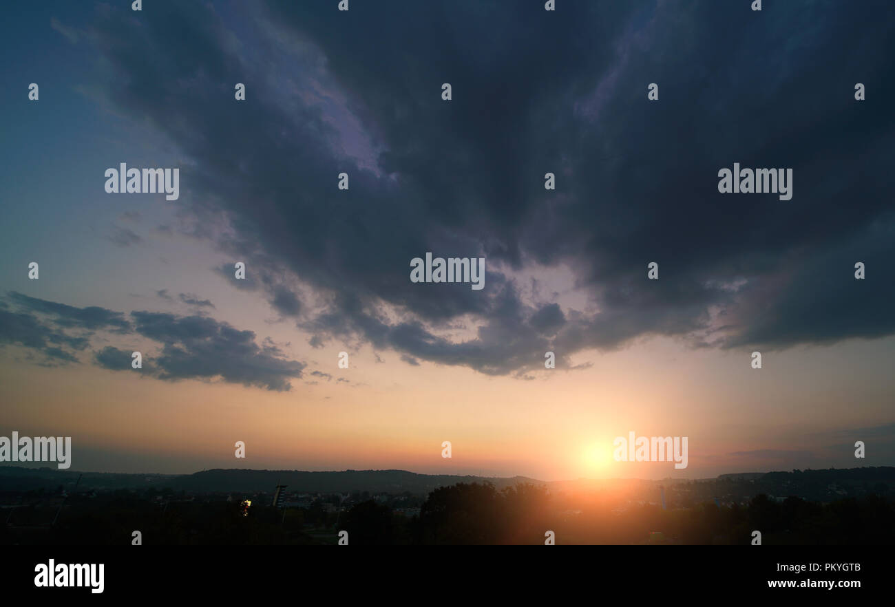 Beautiful sunset sky above clouds with dramatic light Stock Photo - Alamy