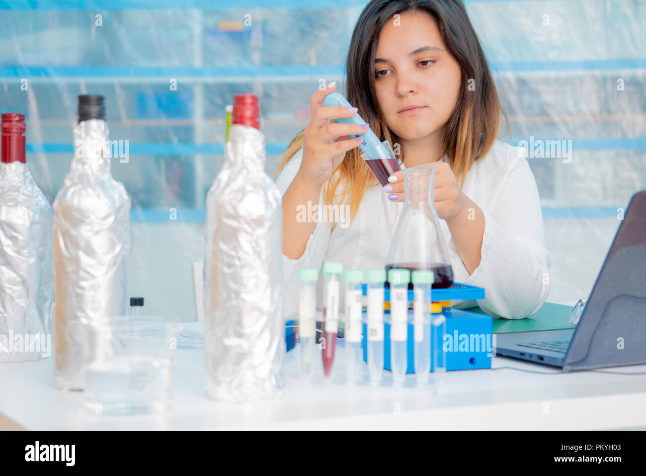 Quality control expert inspecting wine in the food laboratory Stock ...