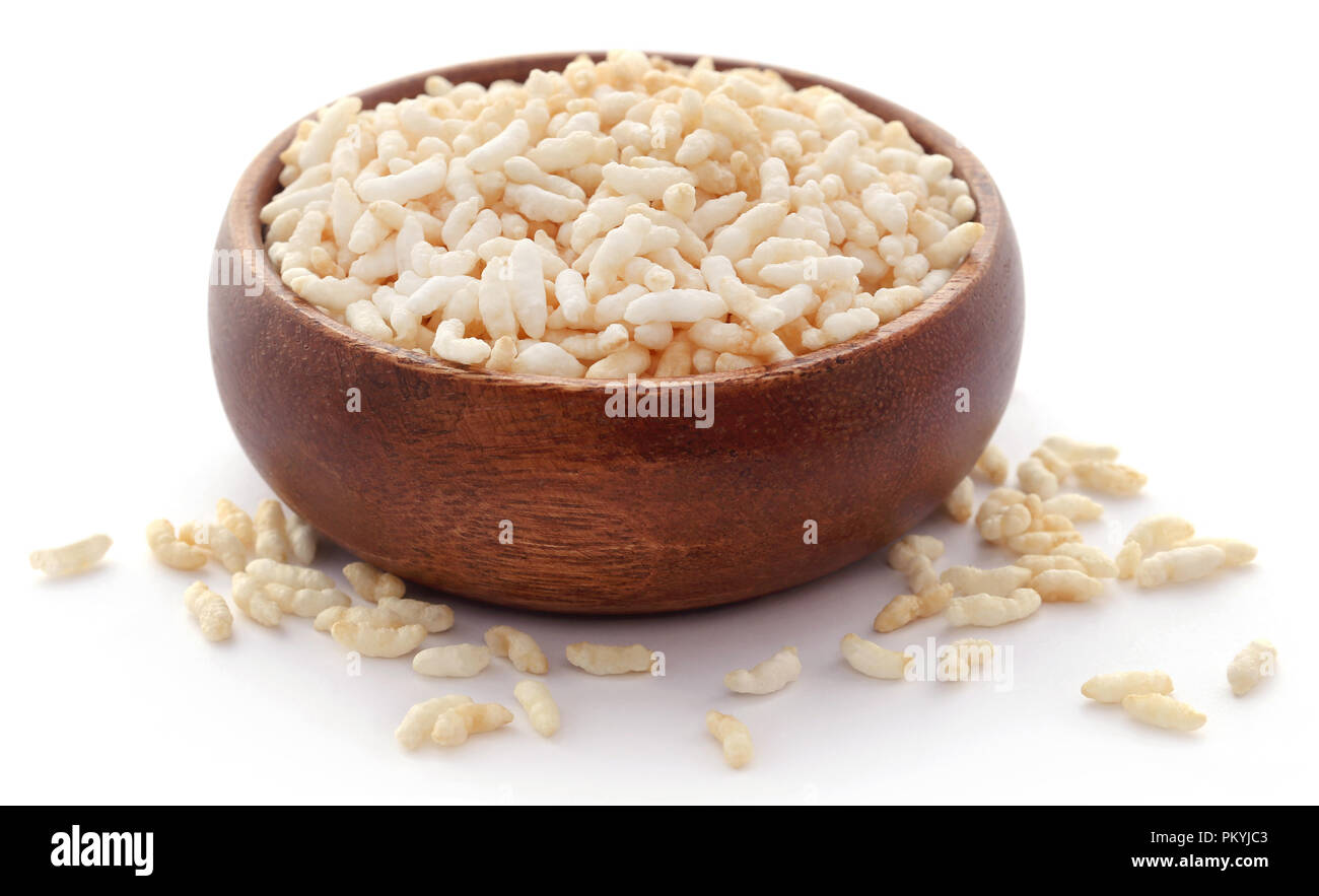 Puffed rice in a bowl over white background Stock Photo - Alamy