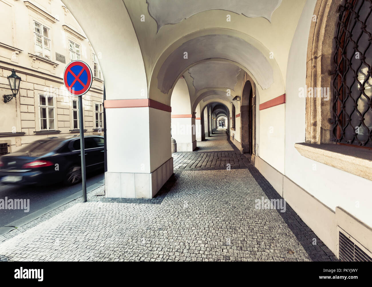 Vintage arc architecture cobblestoned narrow street in Prague, Czech ...