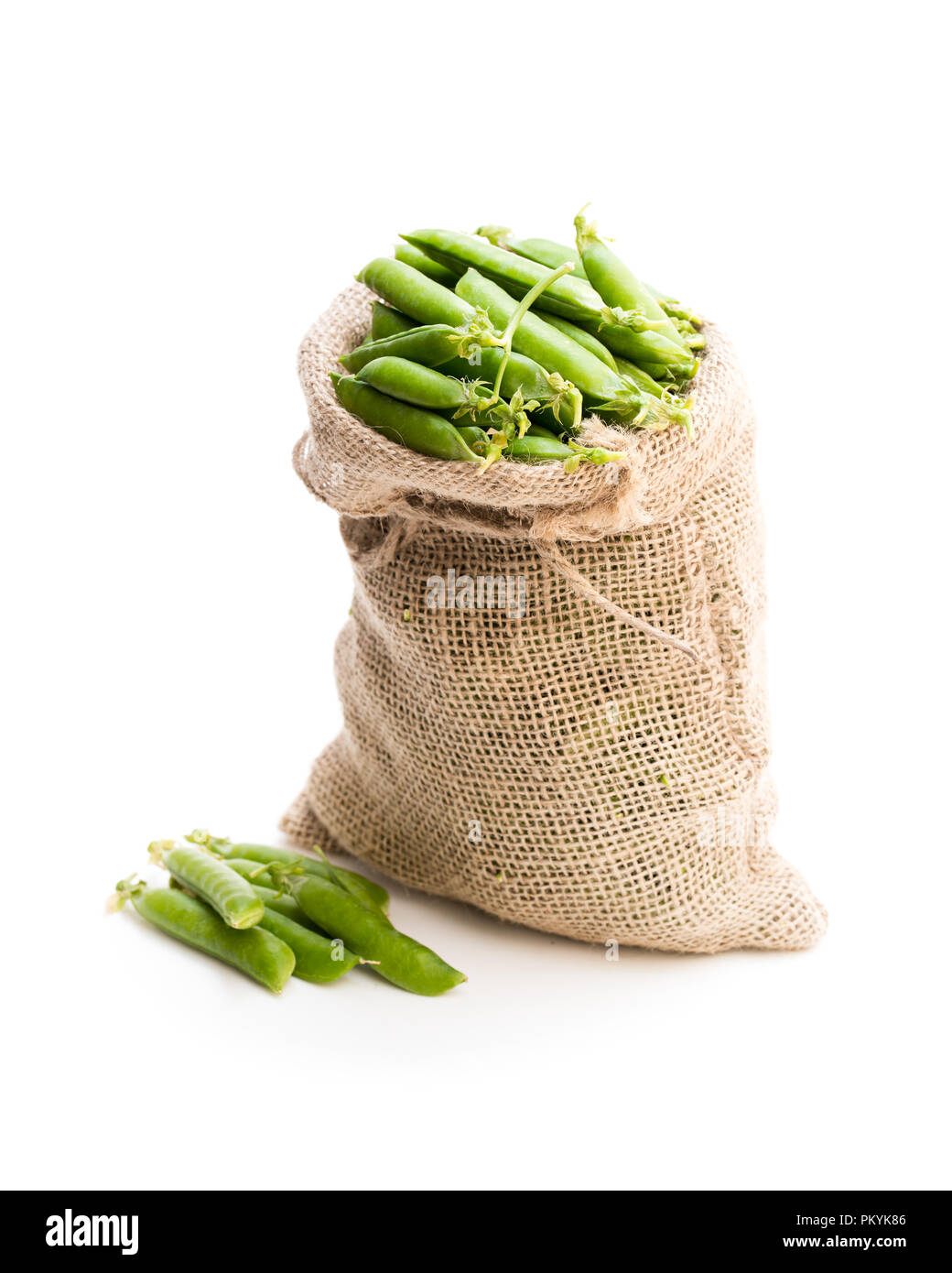 Fresh green pea pods in sack bag isolated on white Stock Photo - Alamy