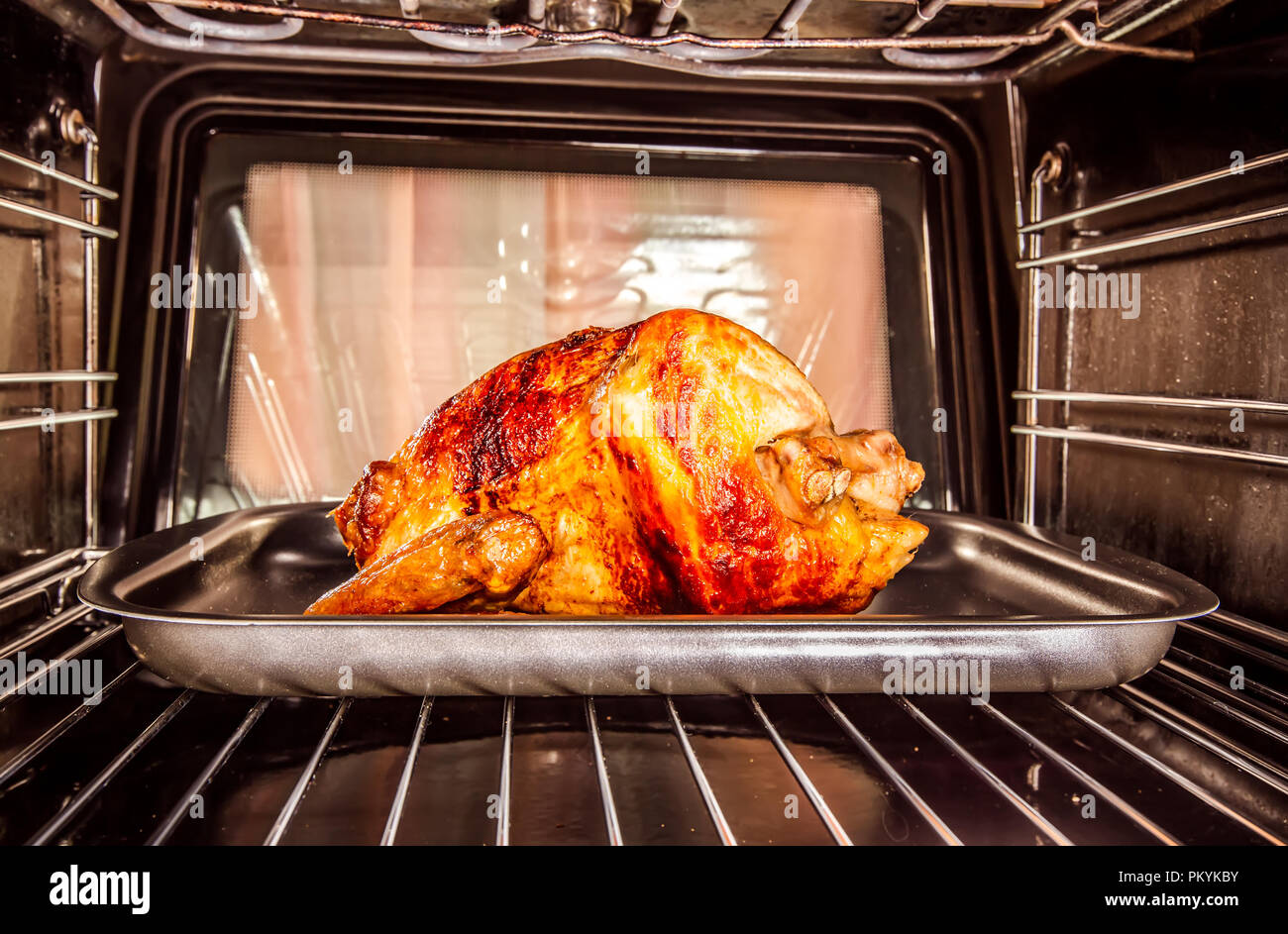 Roast chicken in the oven, view from the inside of the oven. Cooking in ...