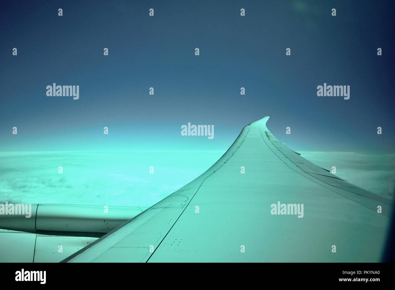 Close-up of Airplane Wing and engine in Mid Air Stock Photo - Alamy