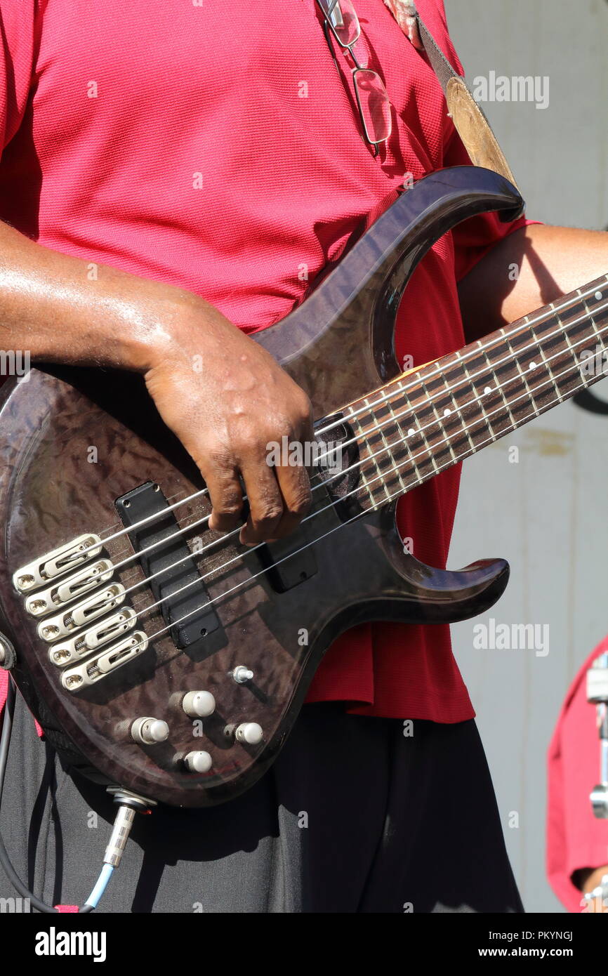 Black bass guitarist Stock Photo - Alamy