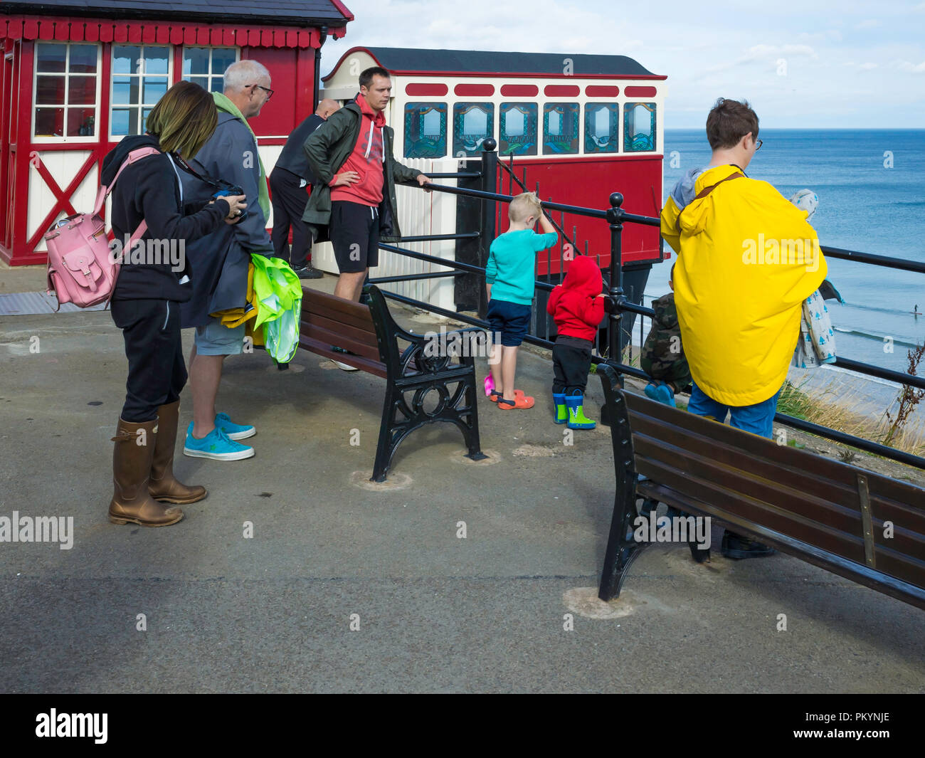 A family at the top station of the Saltburn Cliff Funicular tramway ...