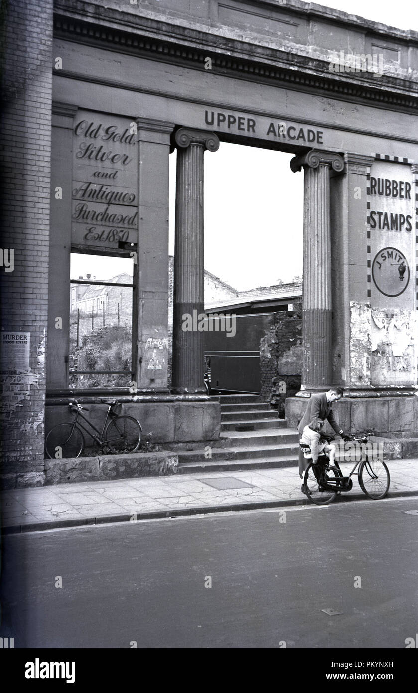 1950, historical, Man with his bicycle and daughter at the ruins of the ...