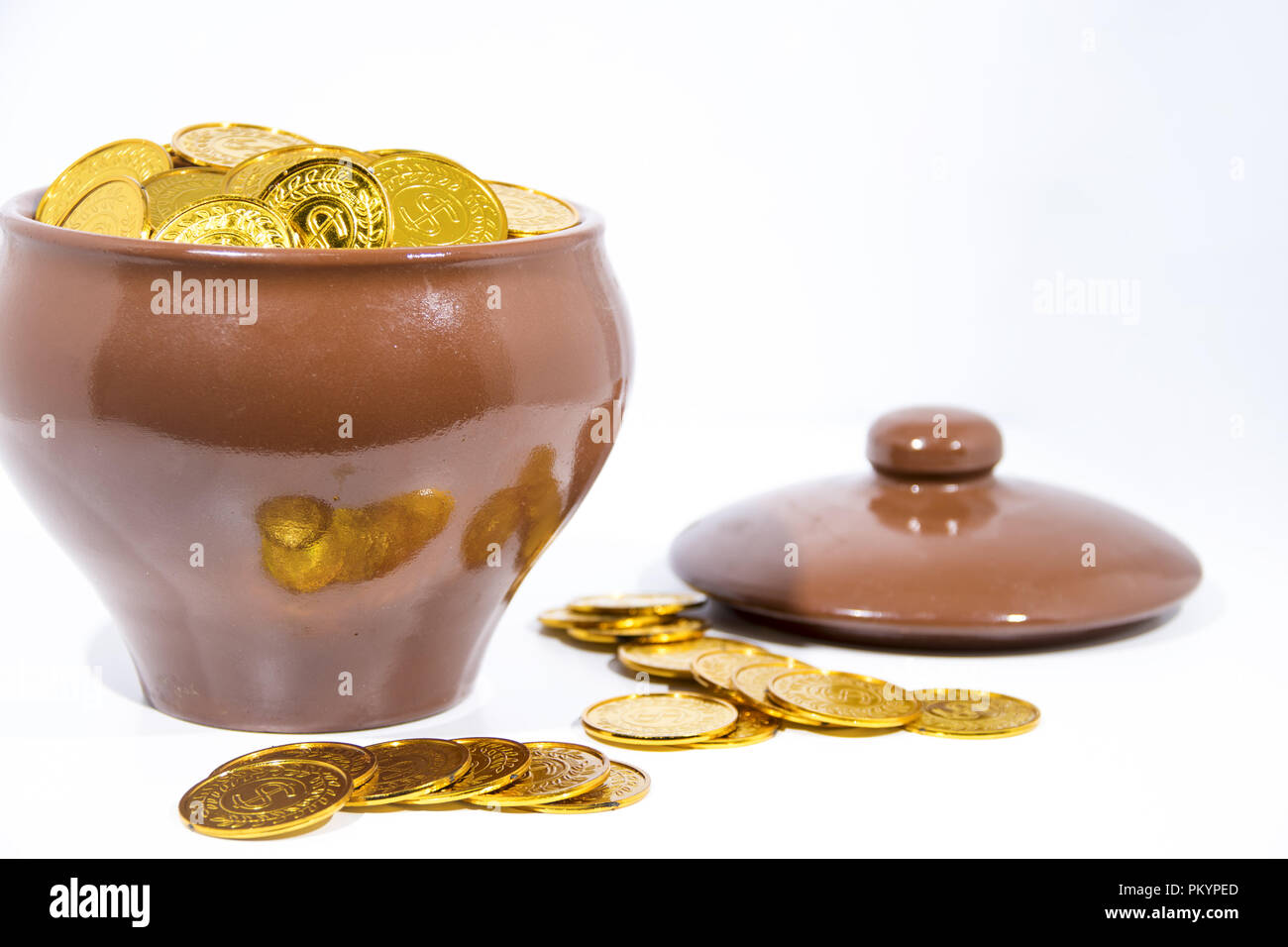 Isolated pot with golden coins. Abstract photo of lucky Stock Photo - Alamy