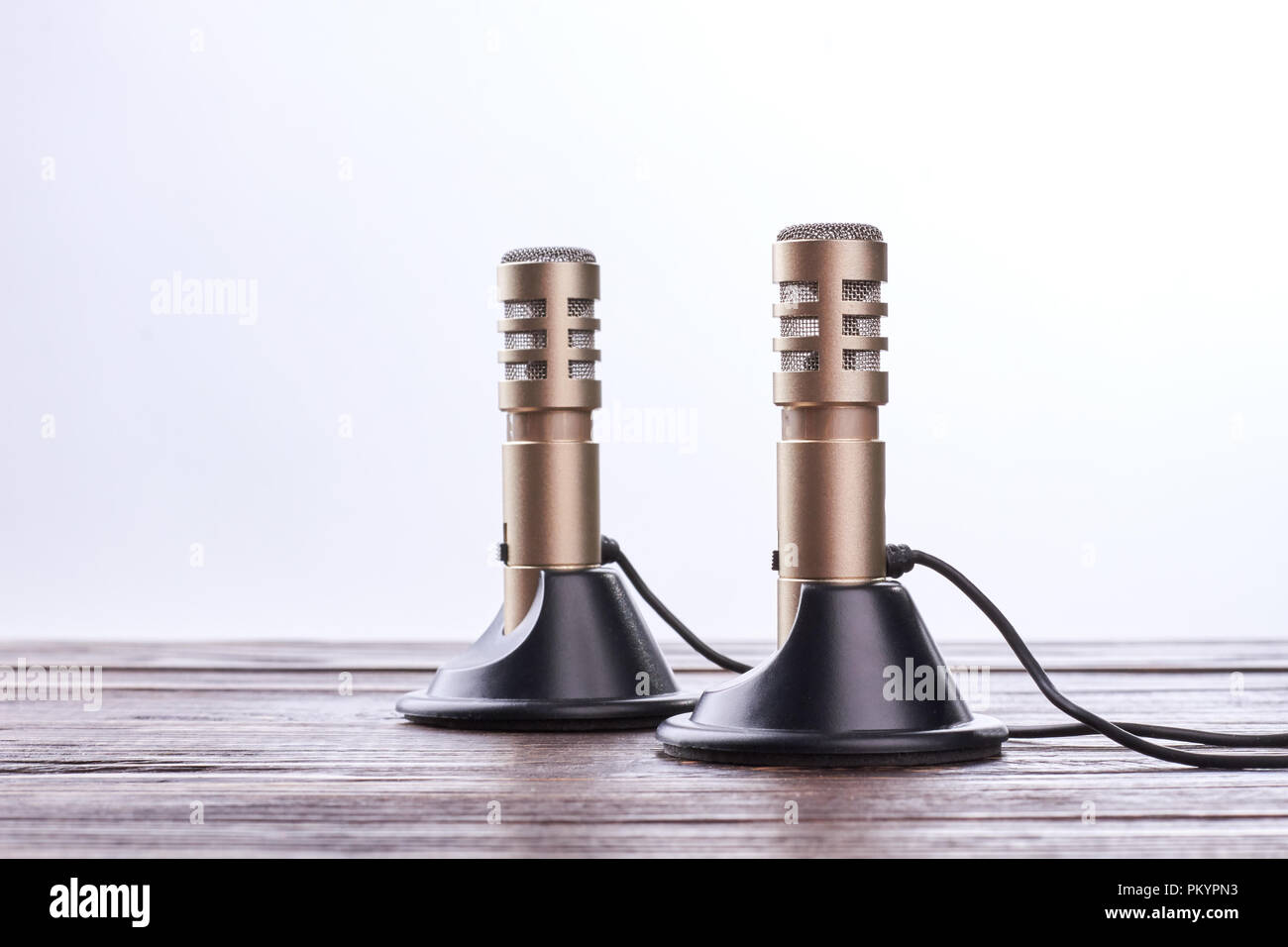 Double stereo microphone on wooden table. Stereo recorder microphone ...