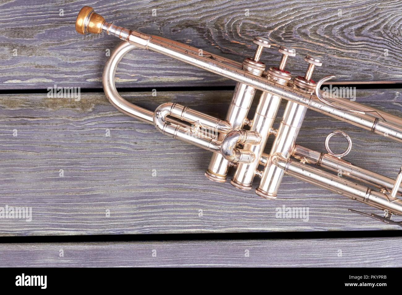 Vintage trumpet with clipping path. Old trumpet on wooden boards. Retro ...