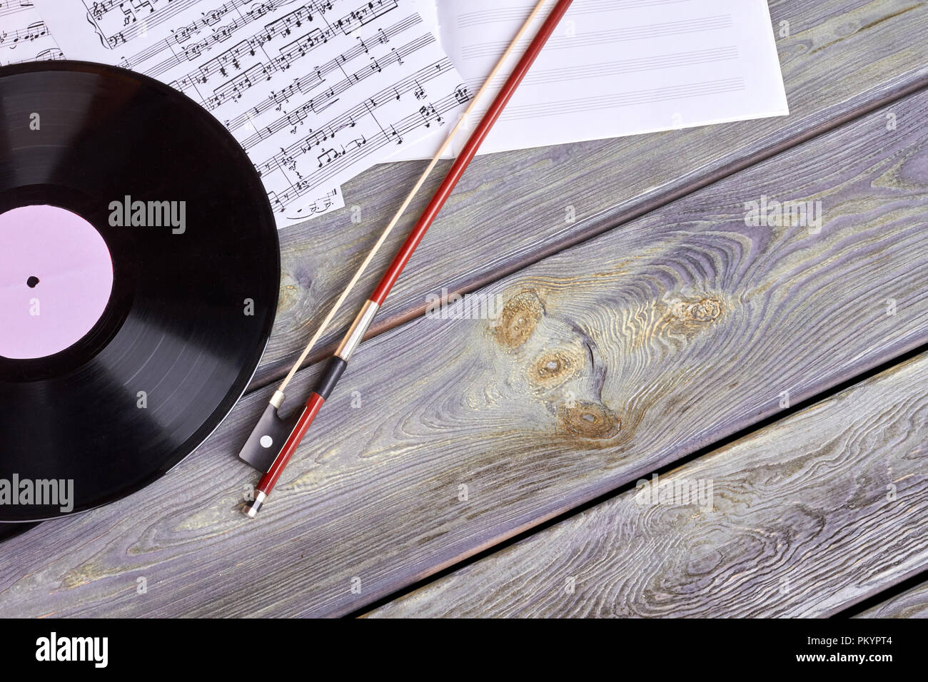Vinyl record and music notes sheet. Gramophone record, musical notes ...