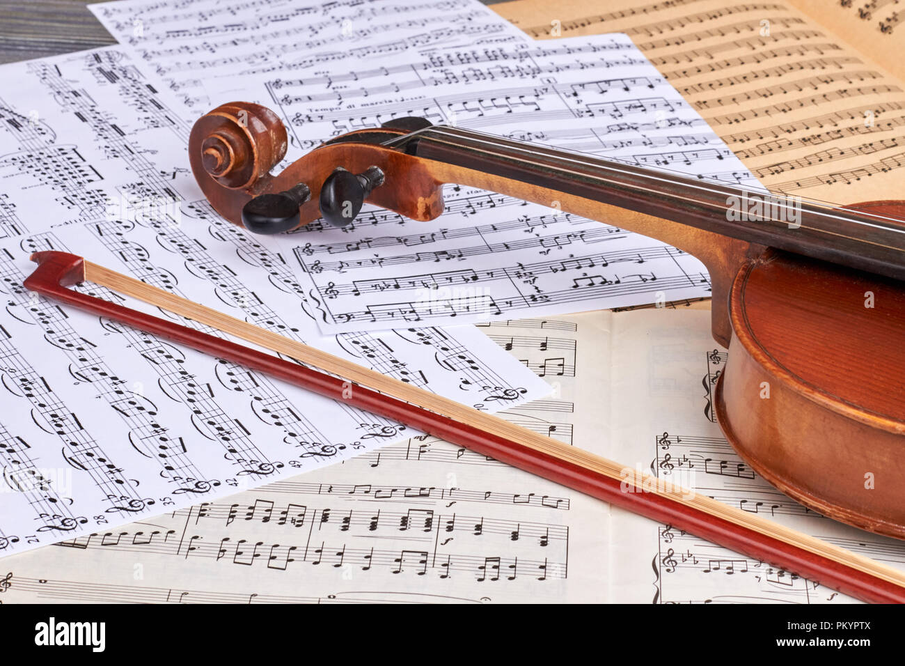 Musical background with old violin. Vintage viola and fiddle stick on ...