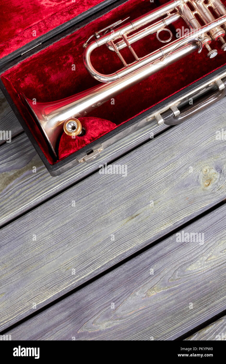 Trumpet in box and copy space. Classical jazzy instrument on wooden ...
