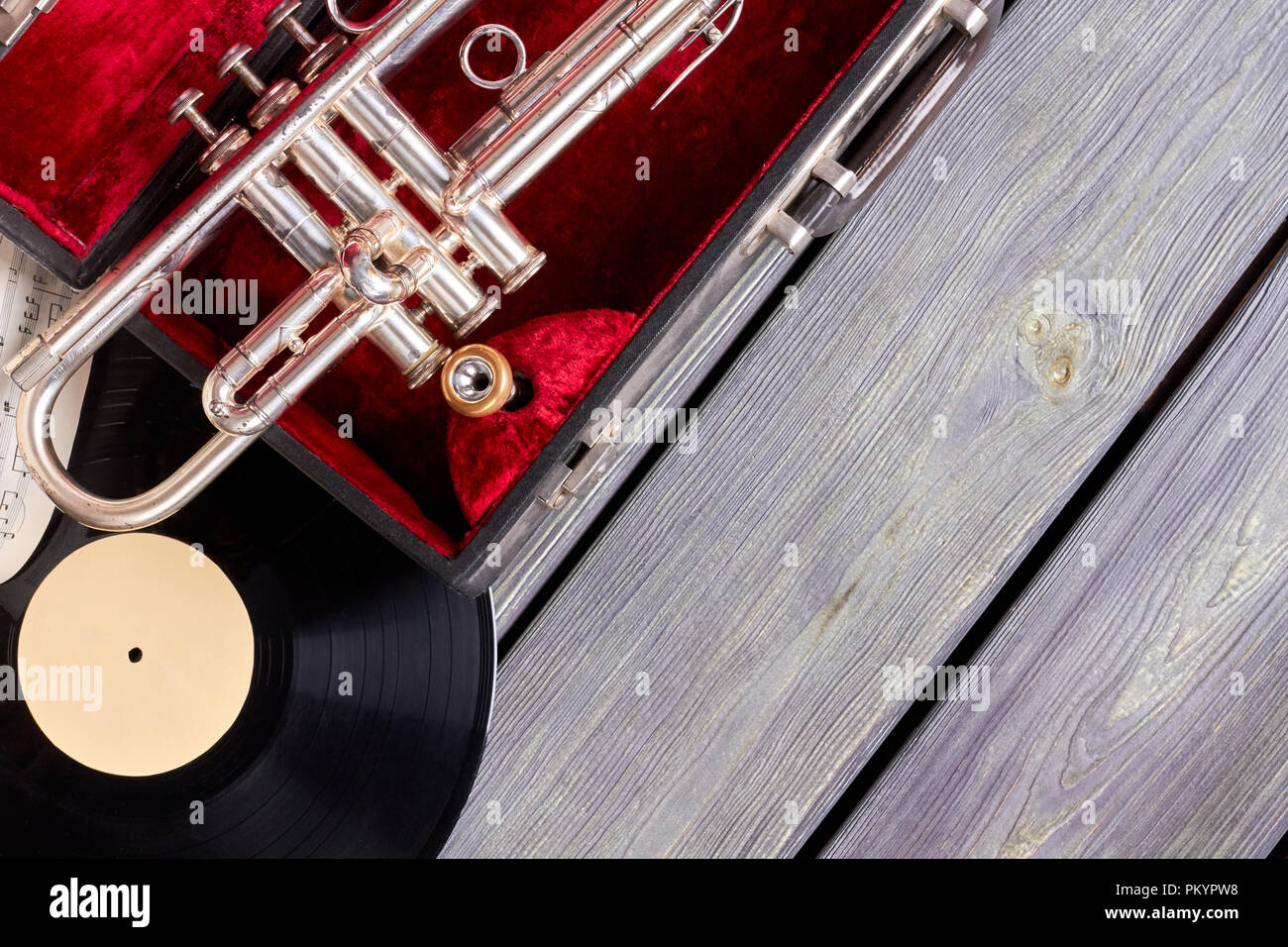 Vintage style musical objects. Trumpet, vinyl disc and musical notes on ...