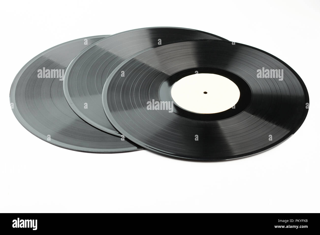 Set of vinyl records over white background. Three gramophone plates ...