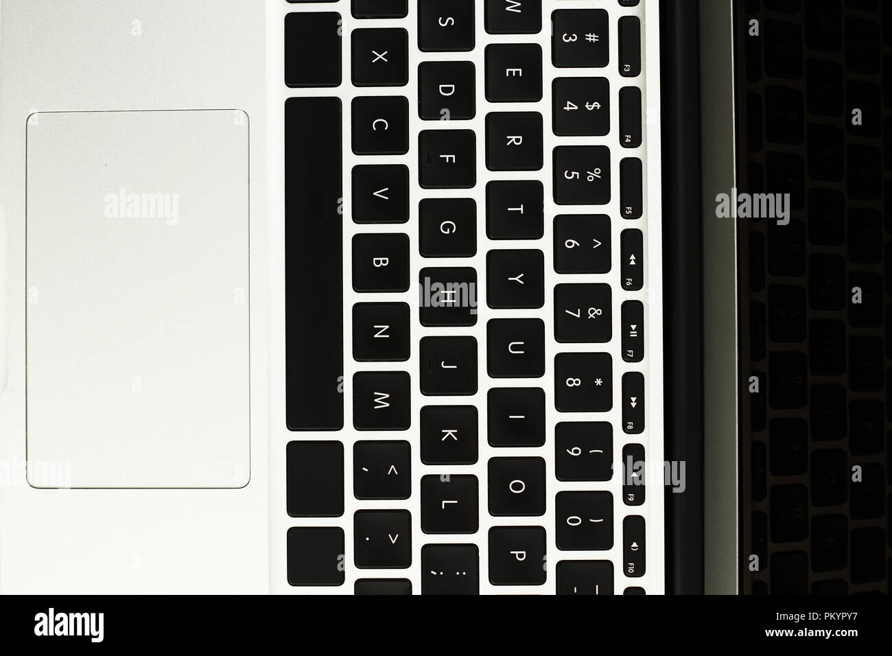 Close up black keyboard of silver laptop. Detail of keyboard of modern ...